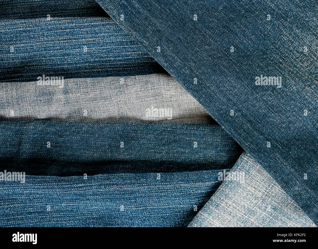 stylish textured background frame from strips of denim in different ...