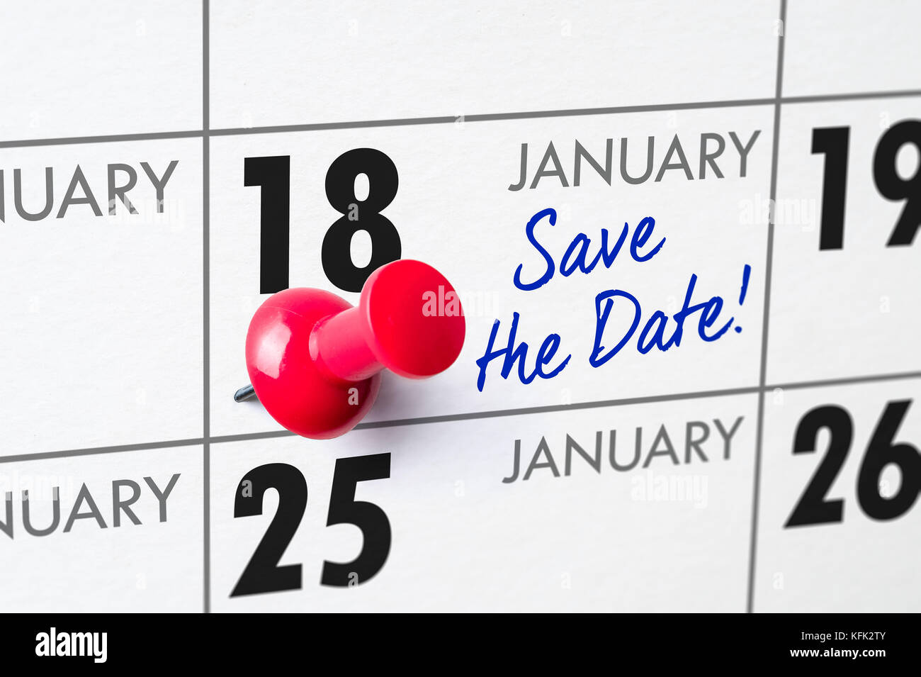 Wall calendar with a red pin - January 18 Stock Photo - Alamy