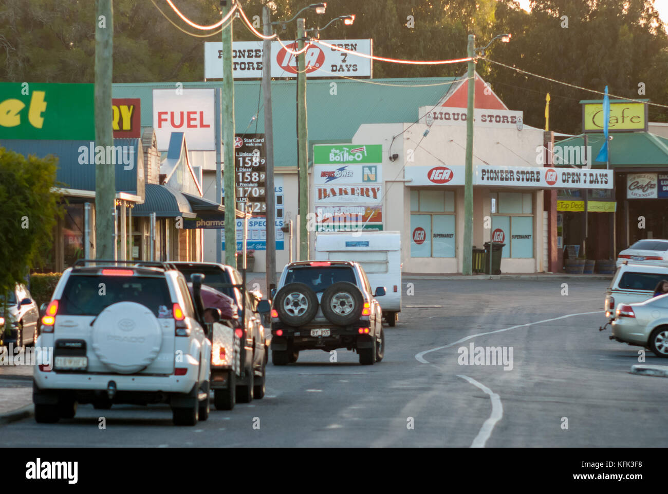 Four wheel drive vehicles park outside a row of shops on Walpole's main ...
