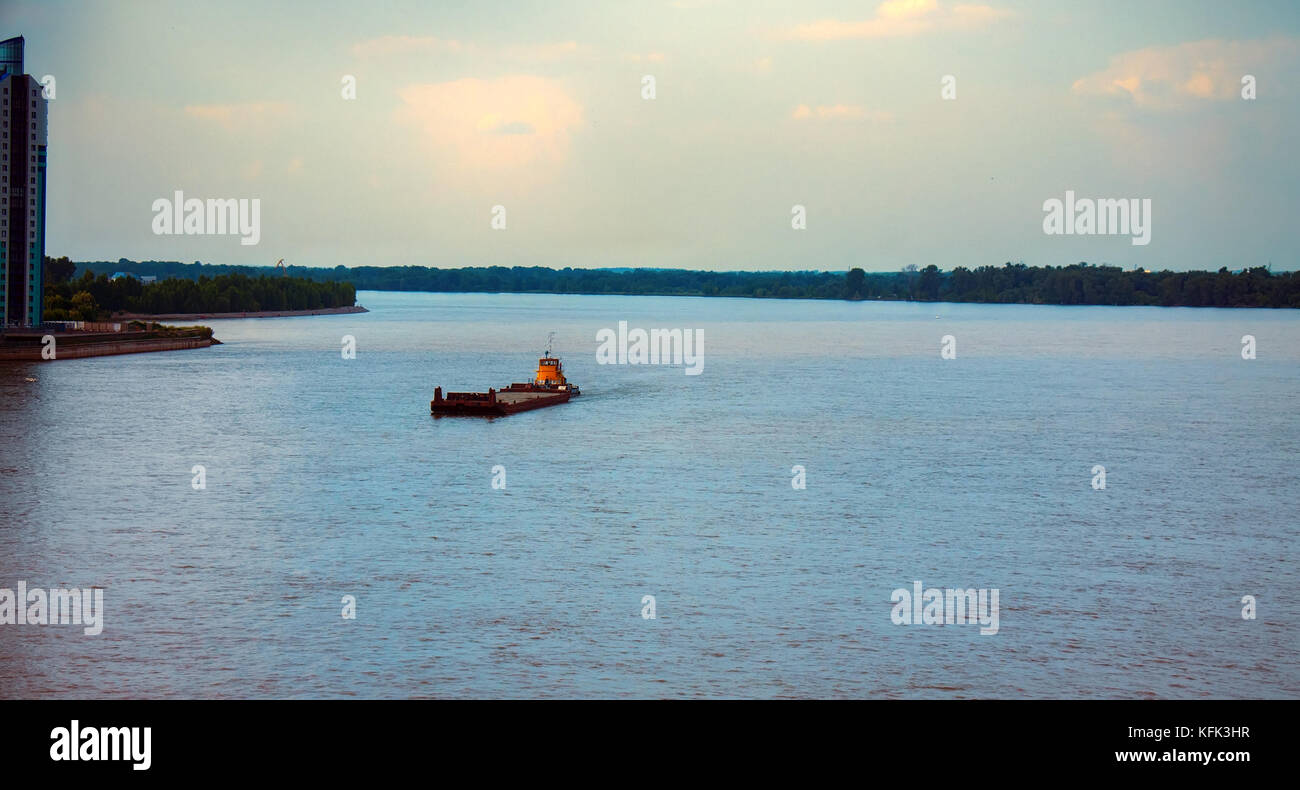 great Siberian Ob river in middle reaches. On river floats propelled ...