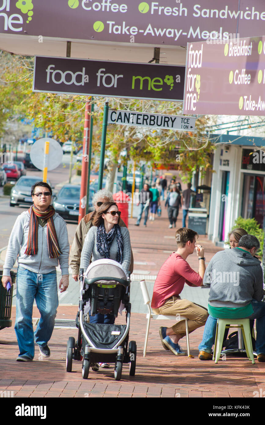 A couple stroll along the footpath on the Albany Highway cafe strip in ...
