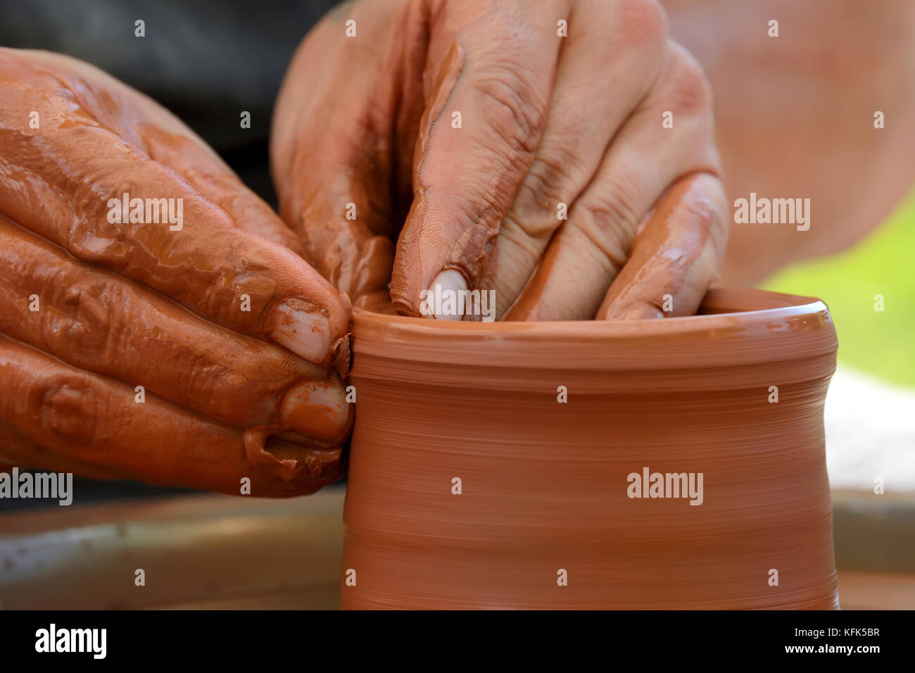 Hands of a potter. Potter making ceramic pot on the pottery wheel Stock ...