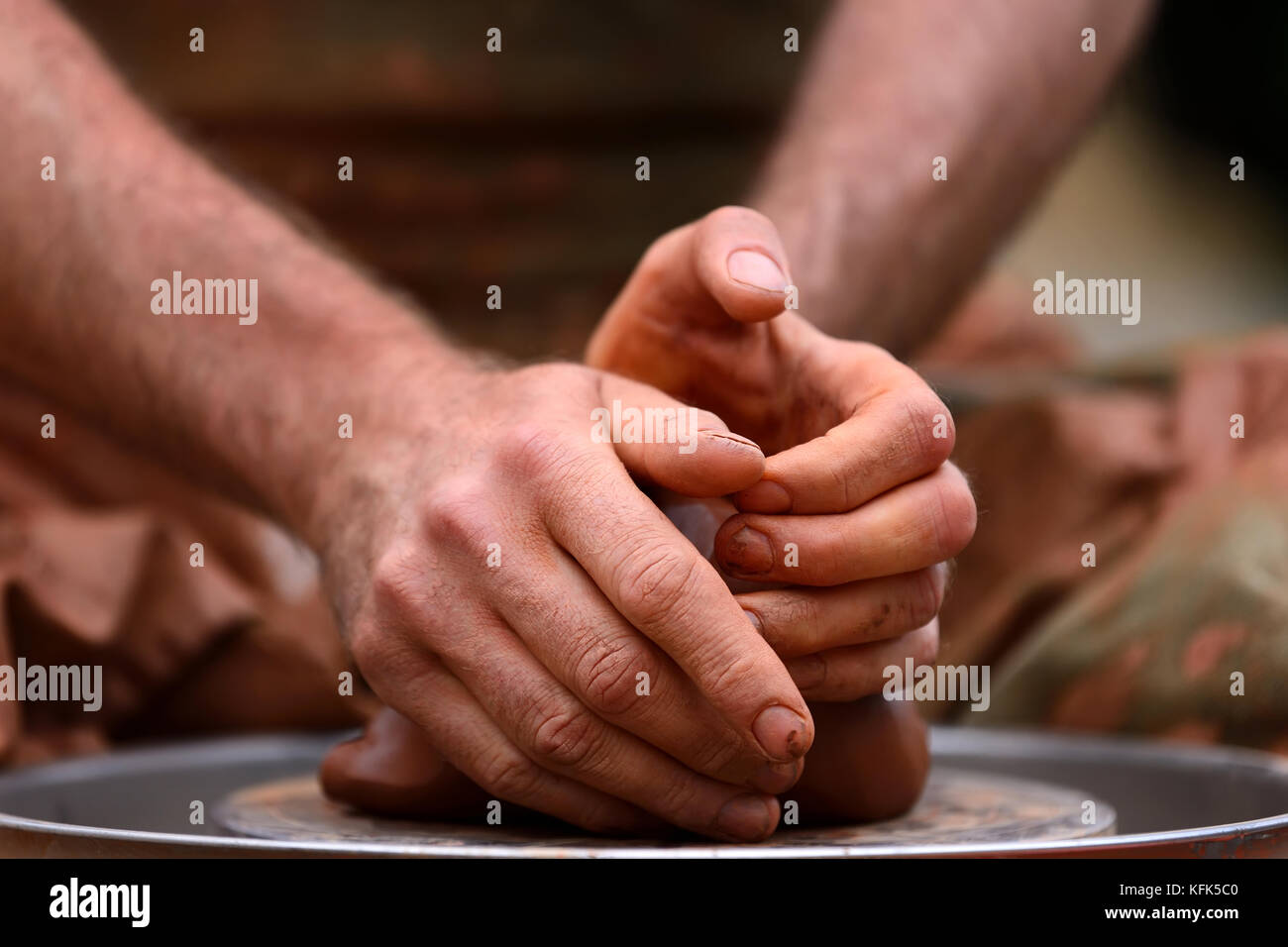 Hands of a potter. Potter making ceramic pot on the pottery wheel Stock ...