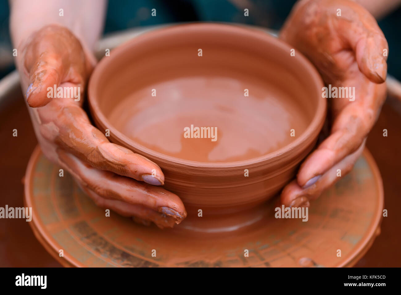 Hands of a potter. Potter making ceramic pot on the pottery wheel Stock ...