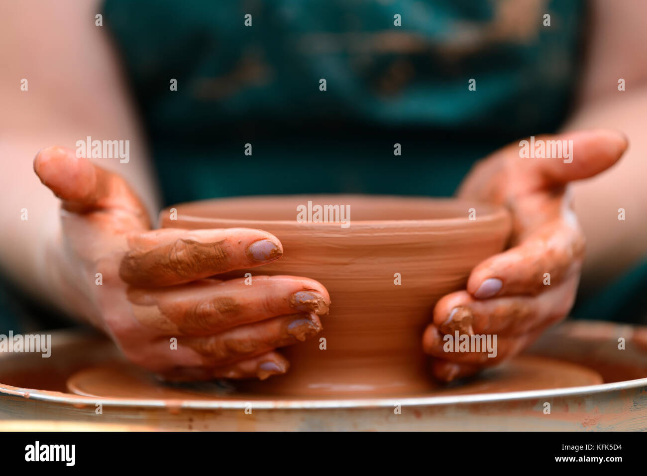 Hands of a potter. Potter making ceramic pot on the pottery wheel Stock ...
