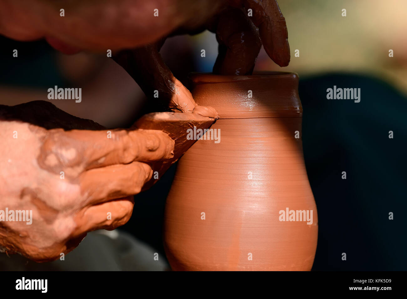 Hands of a potter. Potter making ceramic pot on the pottery wheel Stock ...