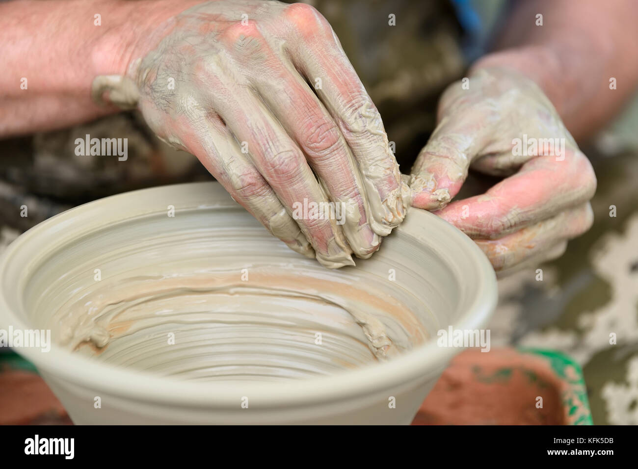 Hands of a potter. Potter making ceramic pot on the pottery wheel Stock ...