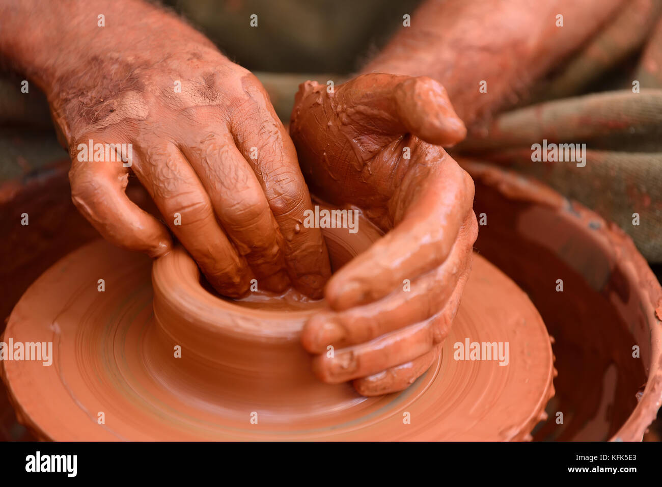 Hands of a potter. Potter making ceramic pot on the pottery wheel Stock ...