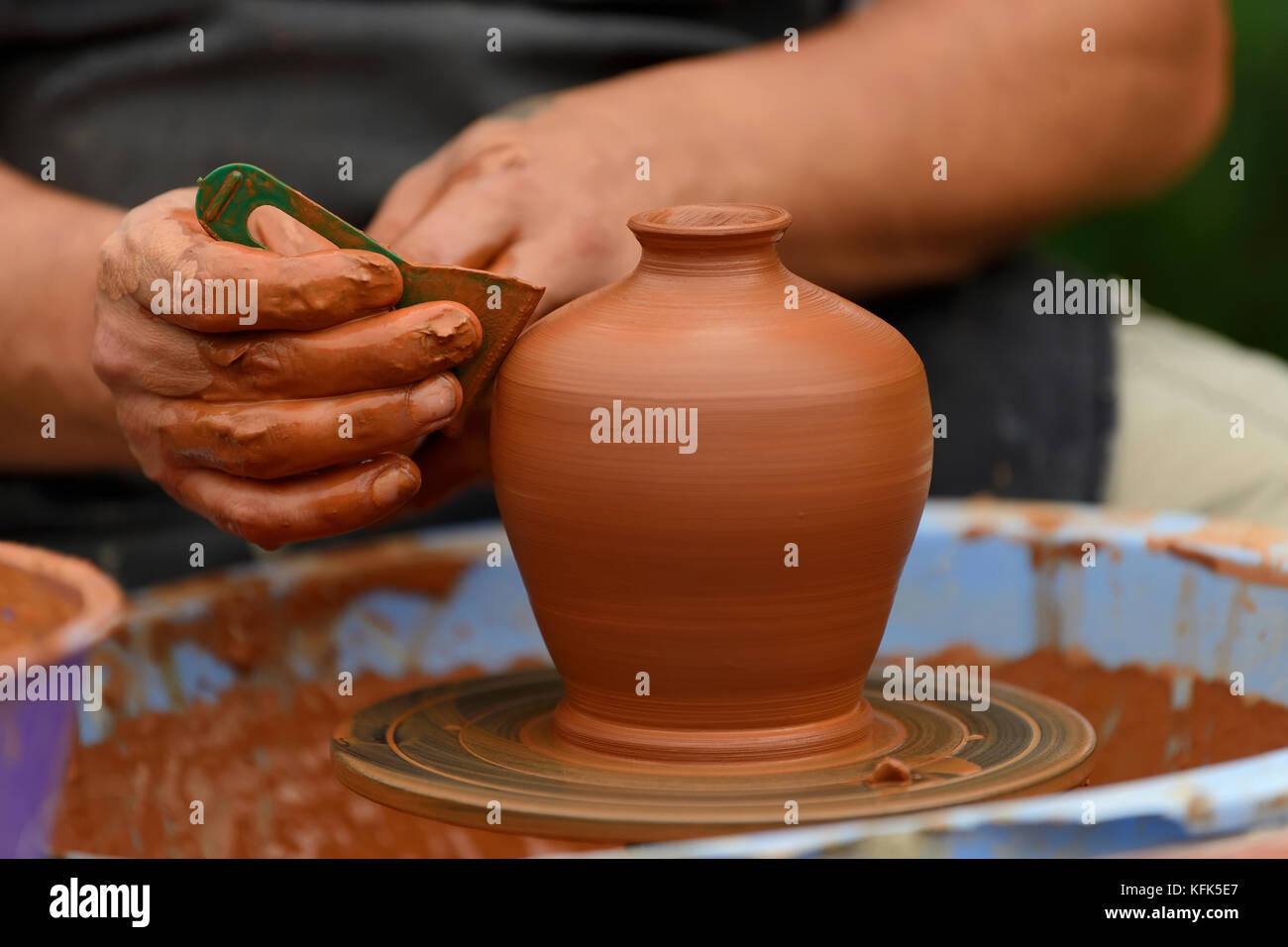 Hands of a potter. Potter making ceramic pot on the pottery wheel Stock ...