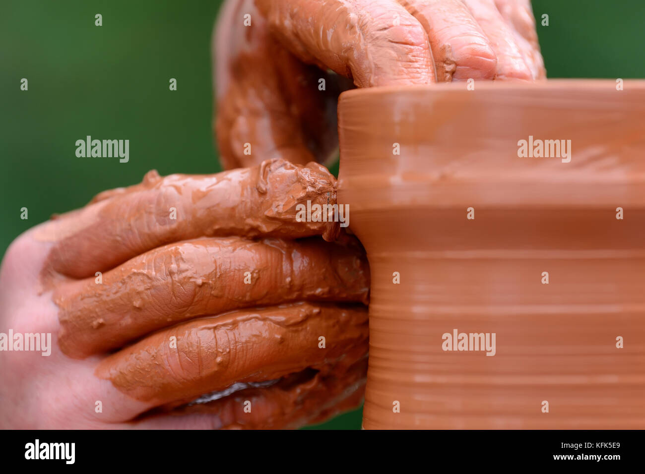 Hands of a potter. Potter making ceramic pot on the pottery wheel Stock ...