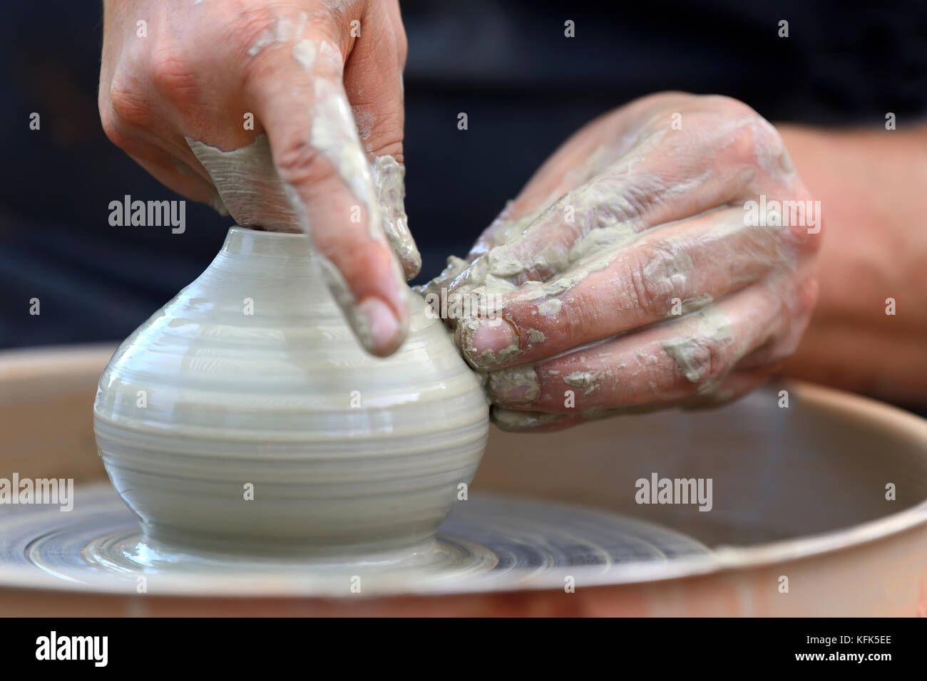 Hands of a potter. Potter making ceramic pot on the pottery wheel Stock ...