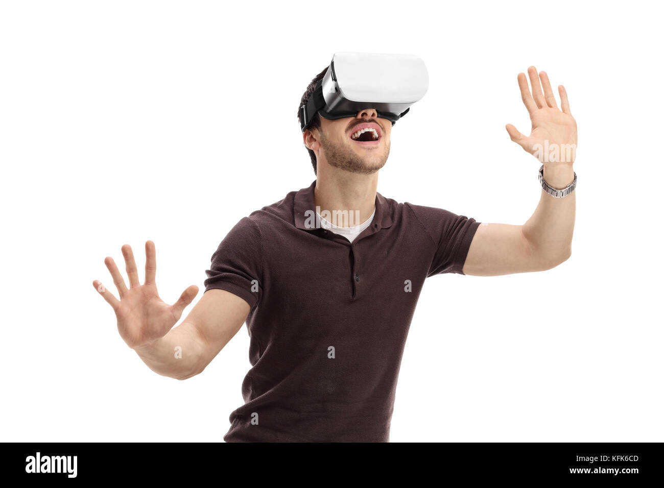 Amazed guy using a virtual reality headset isolated on white background ...