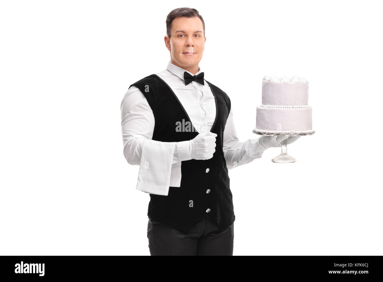 Waiter holding a cake isolated on white background Stock Photo - Alamy