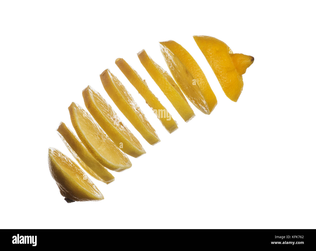 Falling slices of lemon isolated on white background Stock Photo - Alamy