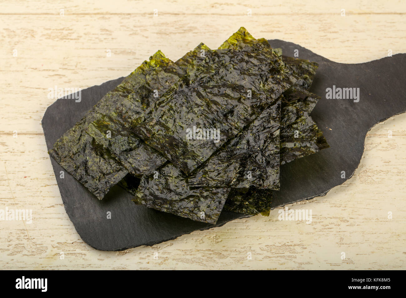 Crispy Nori sheets chips over wooden background Stock Photo - Alamy