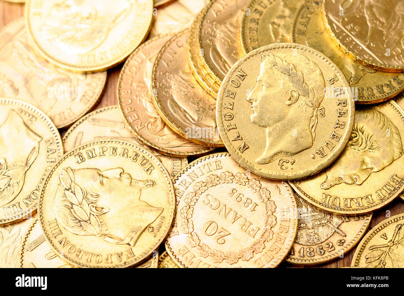 Gold french coin, Napoleon, on wooden table Stock Photo - Alamy