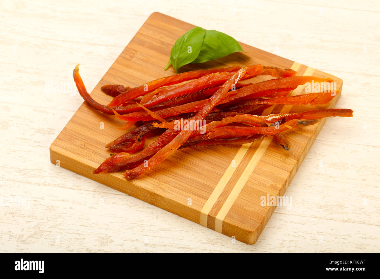 Salmon dry sticks snack Stock Photo - Alamy