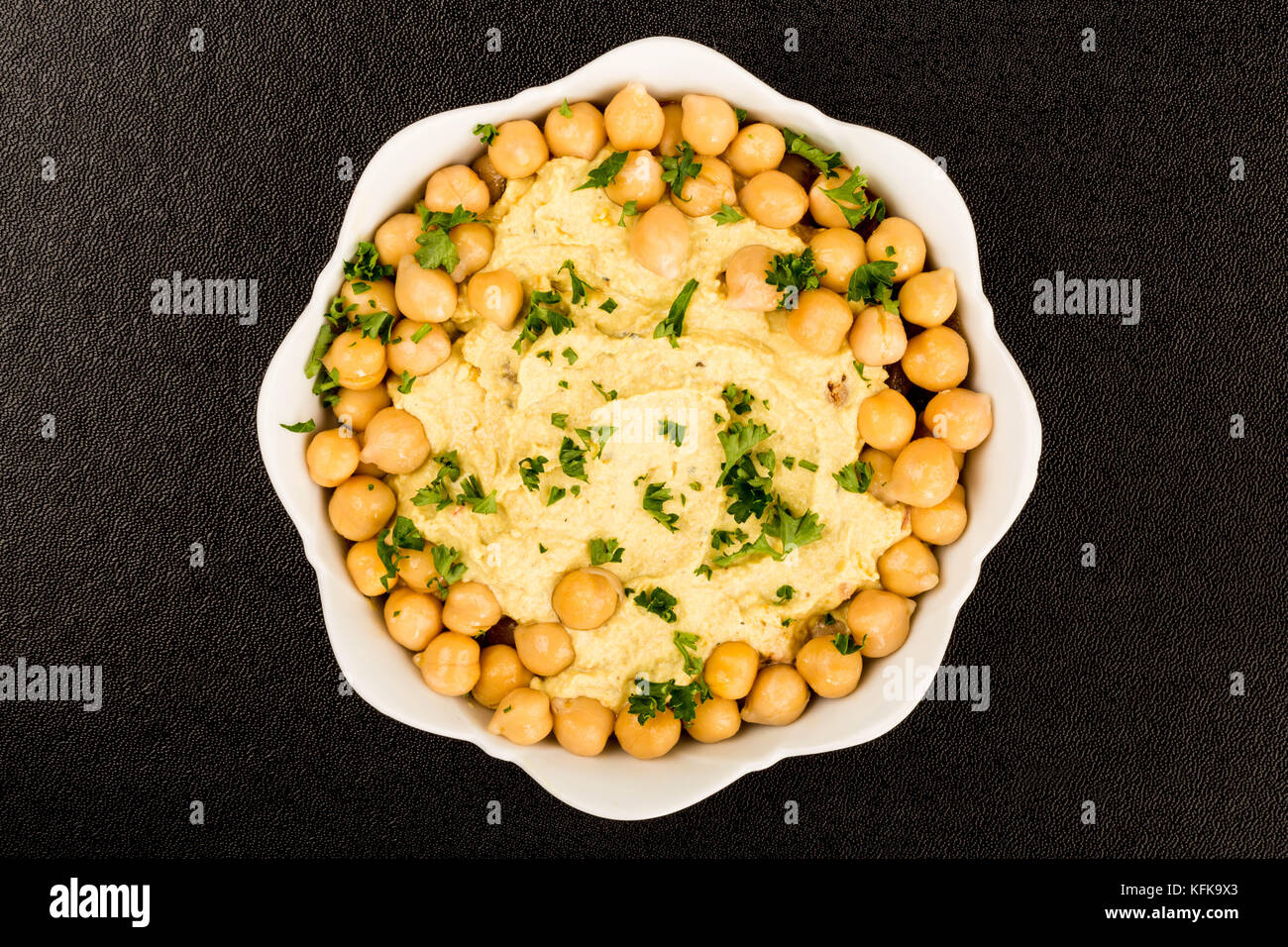 Hummus With Chickpeas and Pitta Bread On A Black Background Stock Photo ...