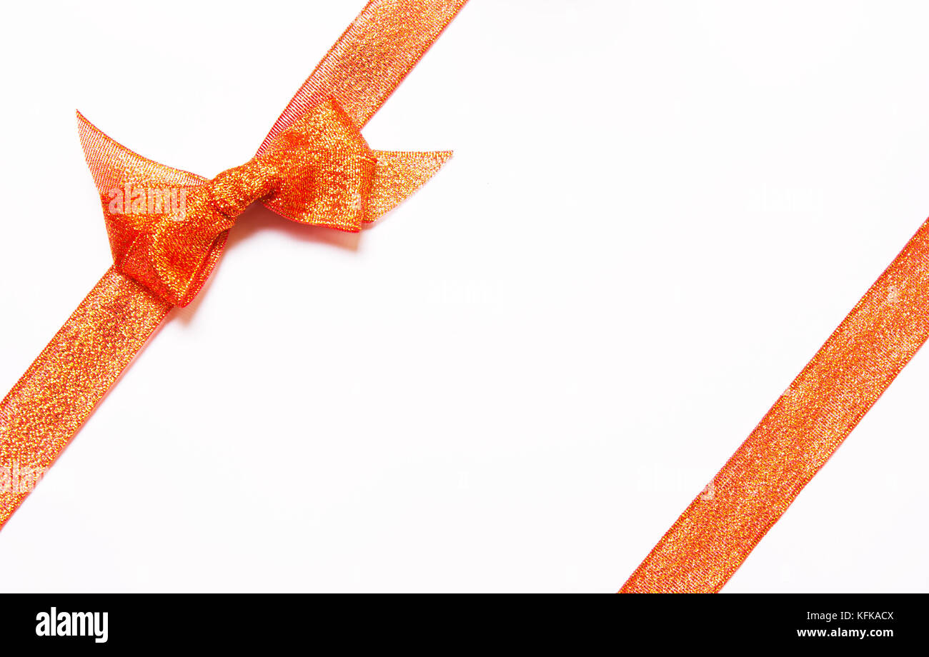 Red golden, orange ribbons with bow with tails on white background. The ...