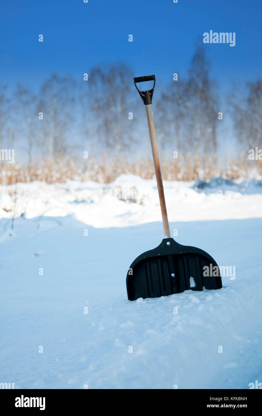 shovel in snow on nature Stock Photo - Alamy