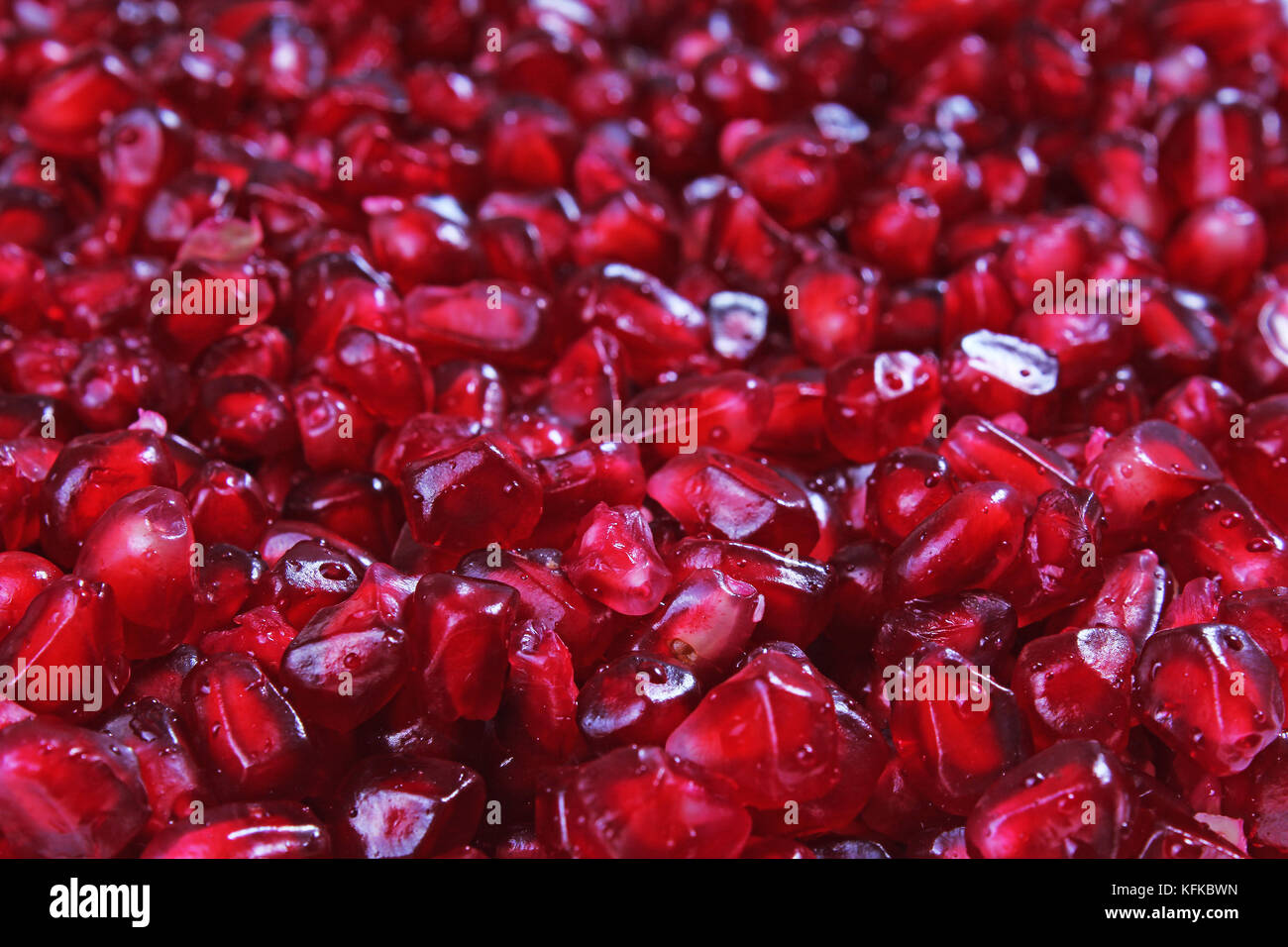 Red ruby pomegranate seeds. Pomegranate seed texture closeup photo ...