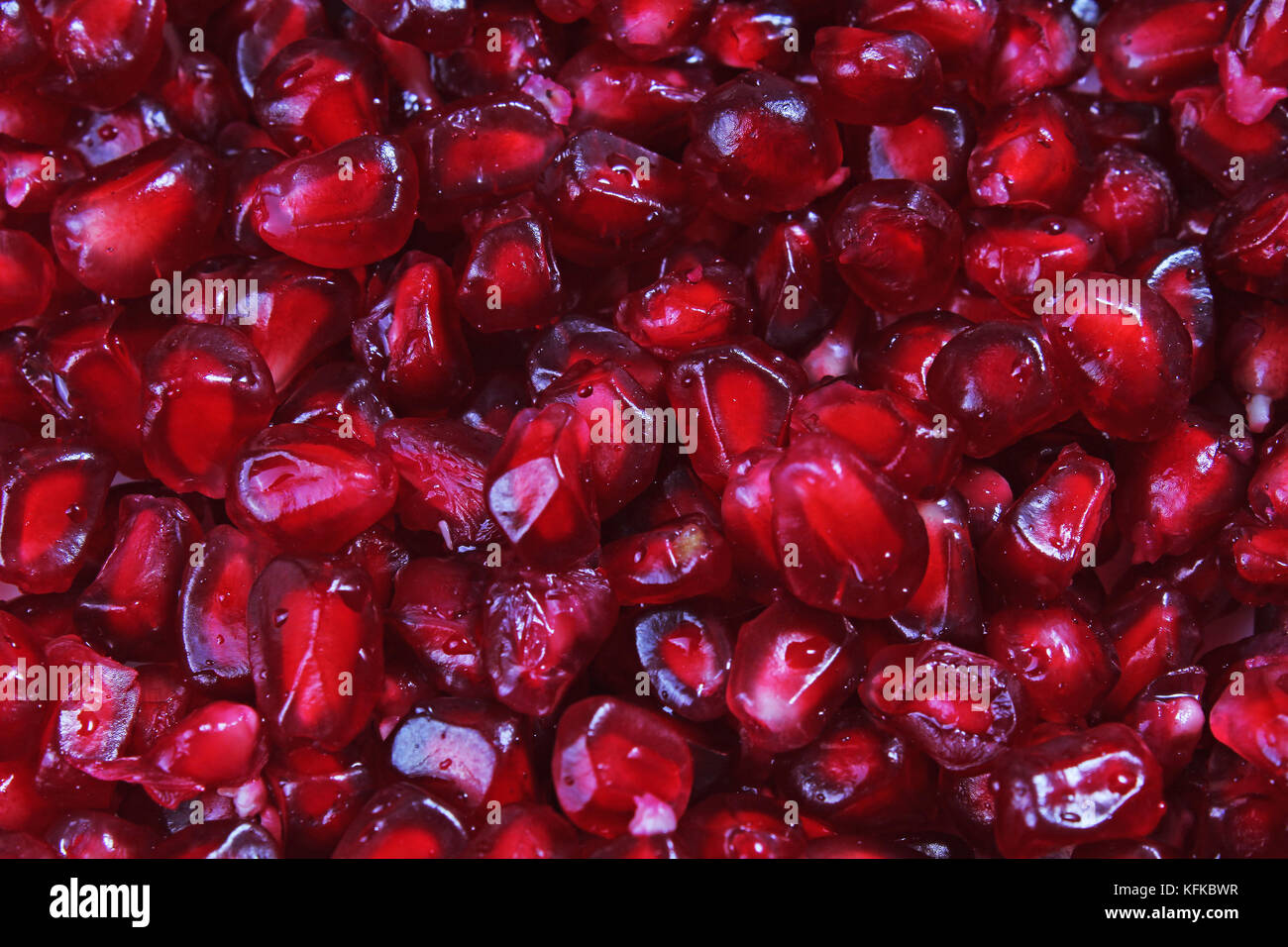 Red ruby pomegranate seeds. Pomegranate seed texture closeup photo ...