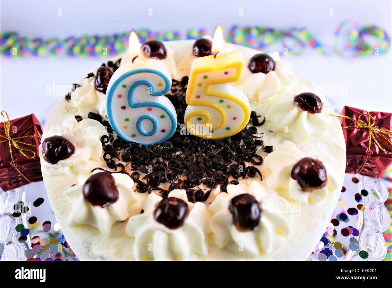 An image of a birthday cake with candle - 65 Stock Photo - Alamy