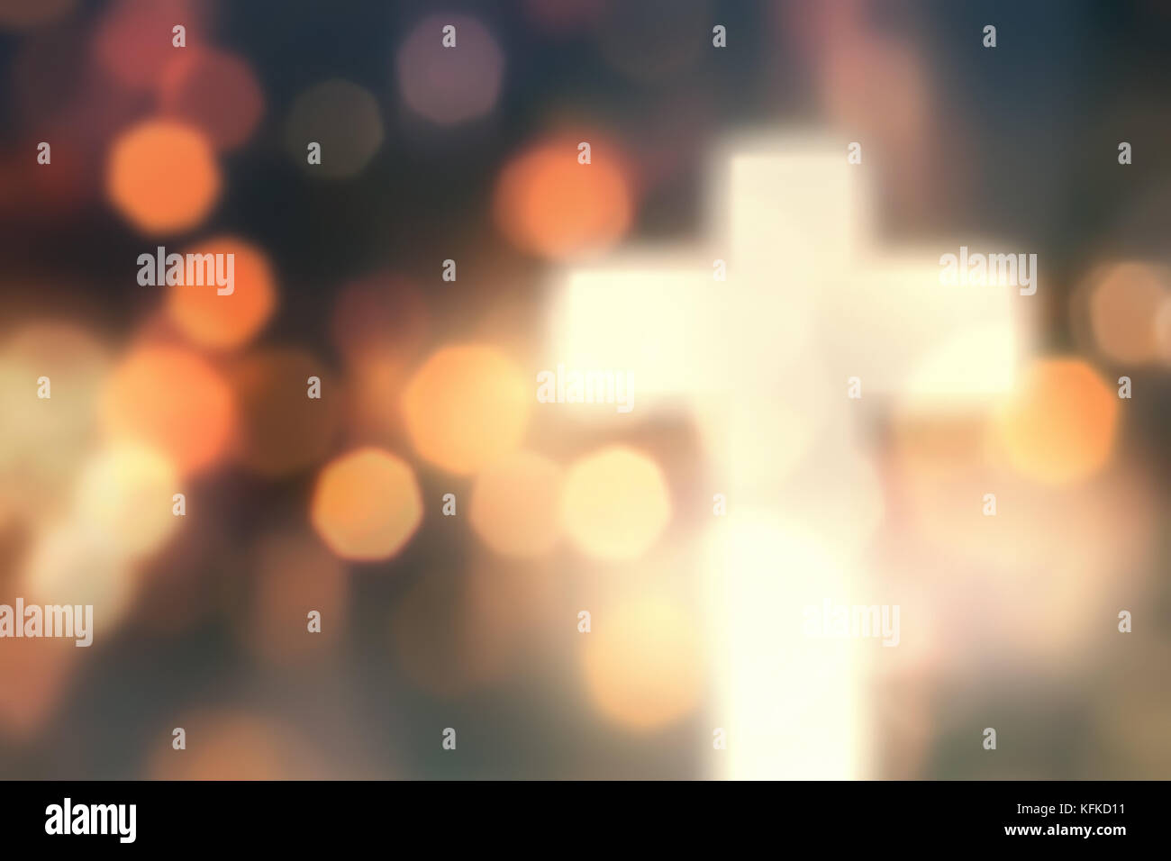 Defocused christian cross against light background Stock Photo - Alamy