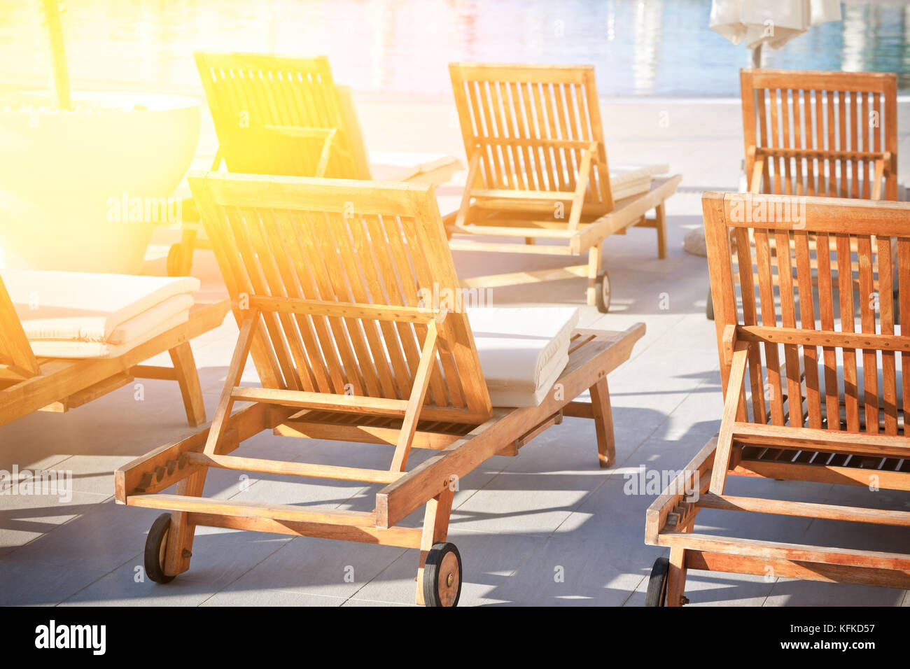 Hotel Poolside Chairs with Sunlight. Horizontal filtered shot Stock ...
