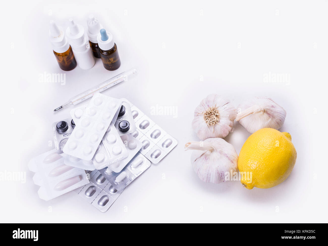 Lemon and garlic versus pills tablets and drugs Stock Photo - Alamy