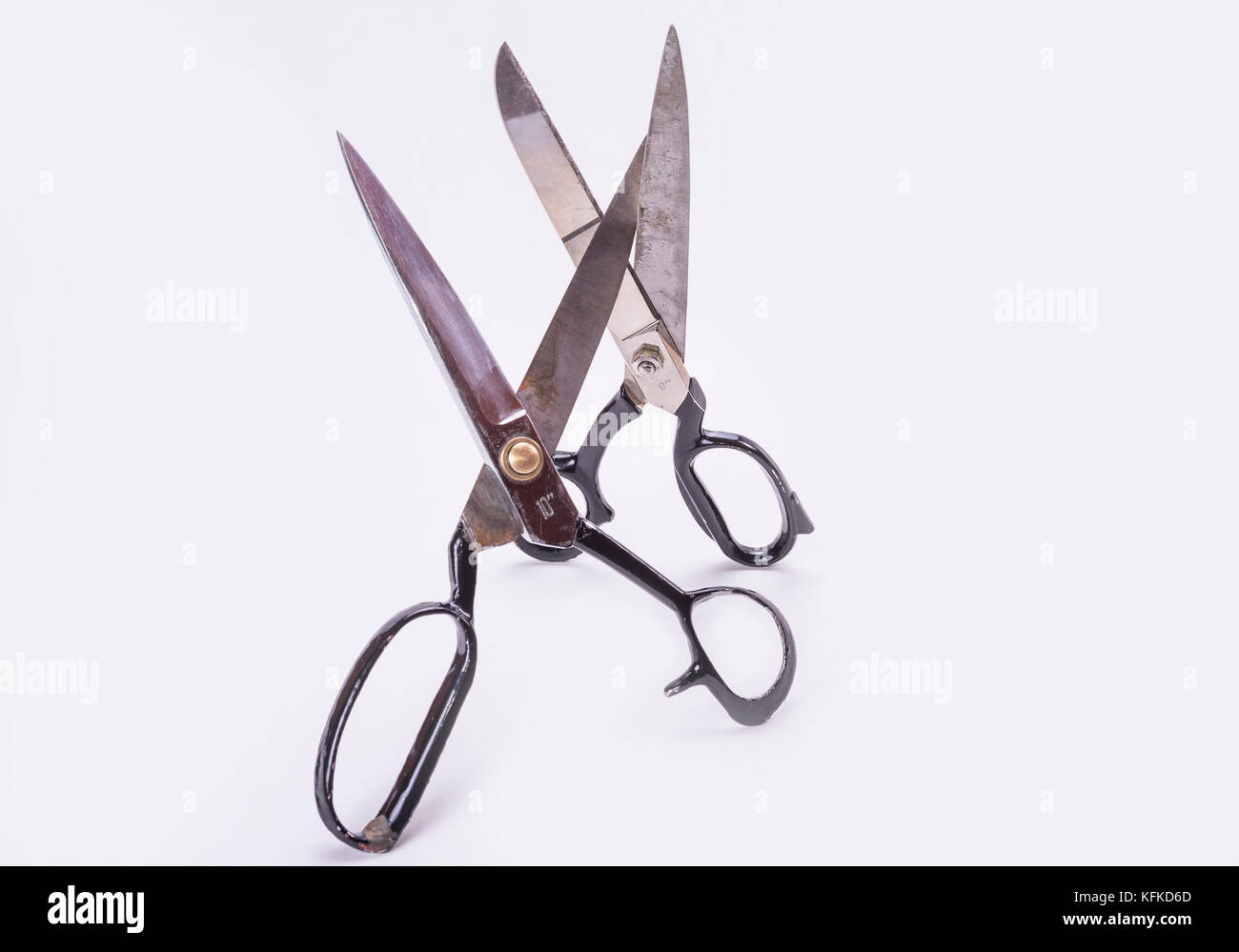 Old scissors two pairs on white background standing up Stock Photo - Alamy