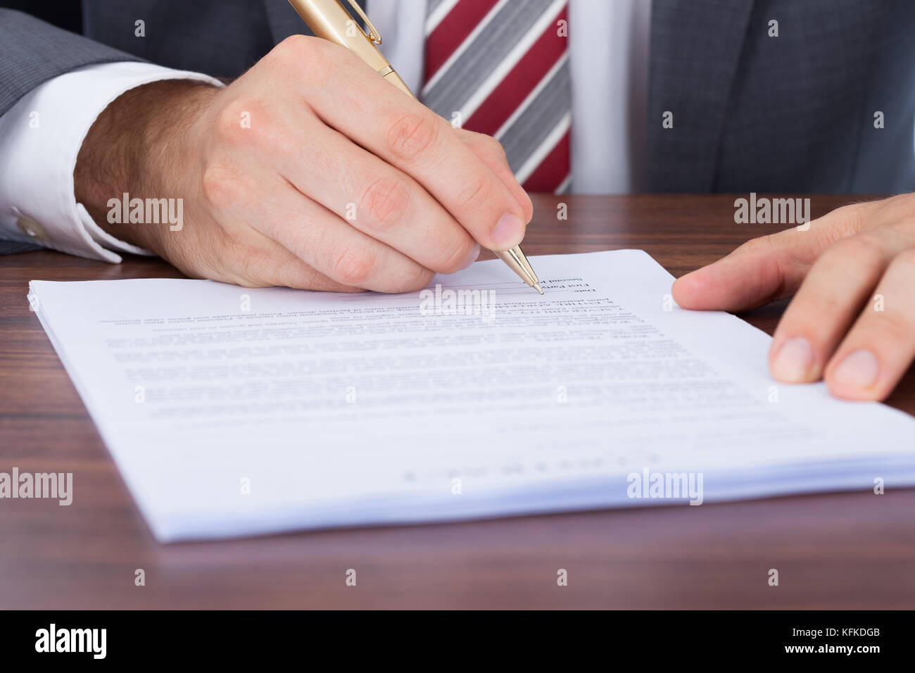Signing at desk hi-res stock photography and images - Alamy