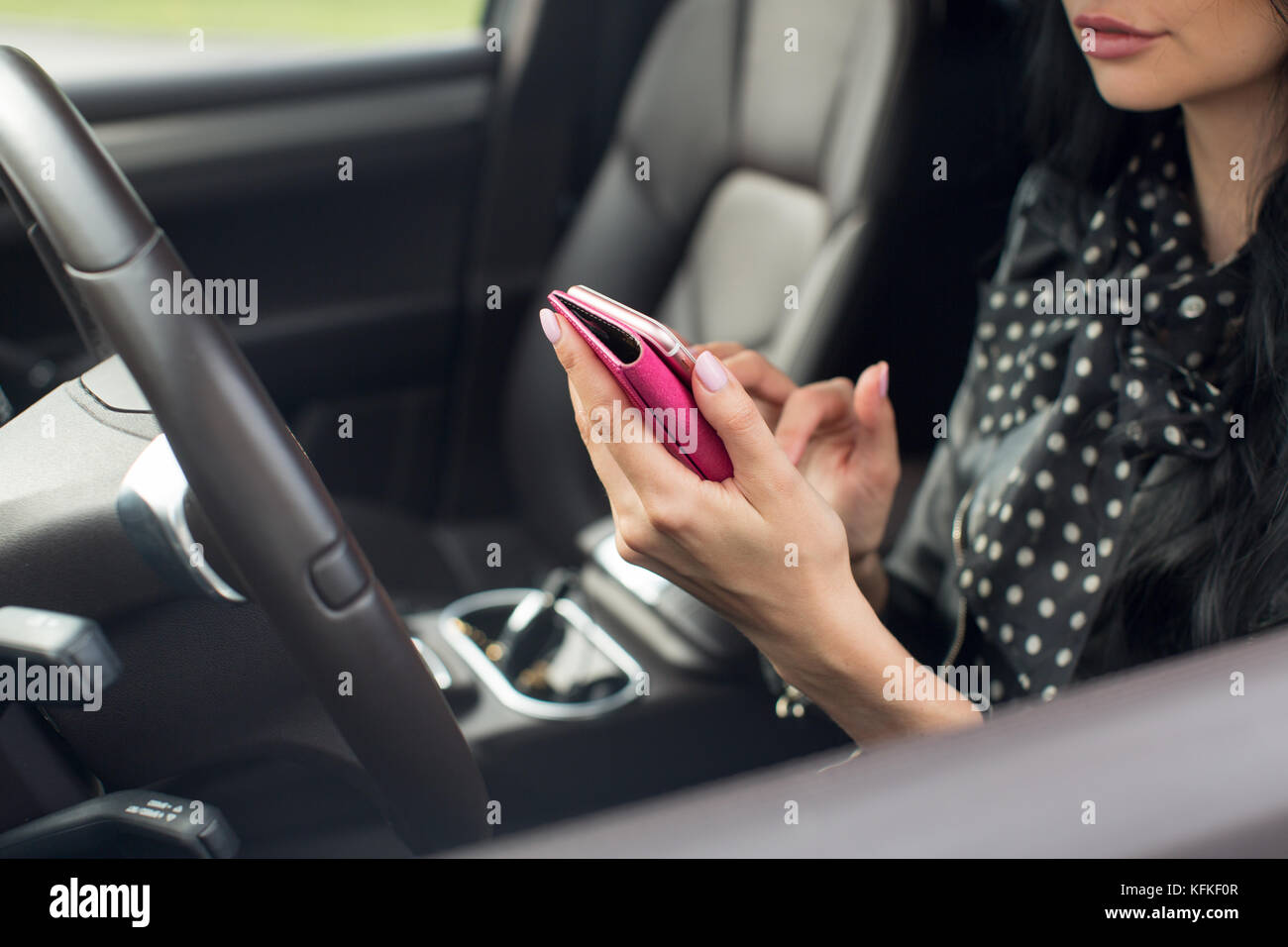 woman using smartphone. Blurred car interior Stock Photo - Alamy