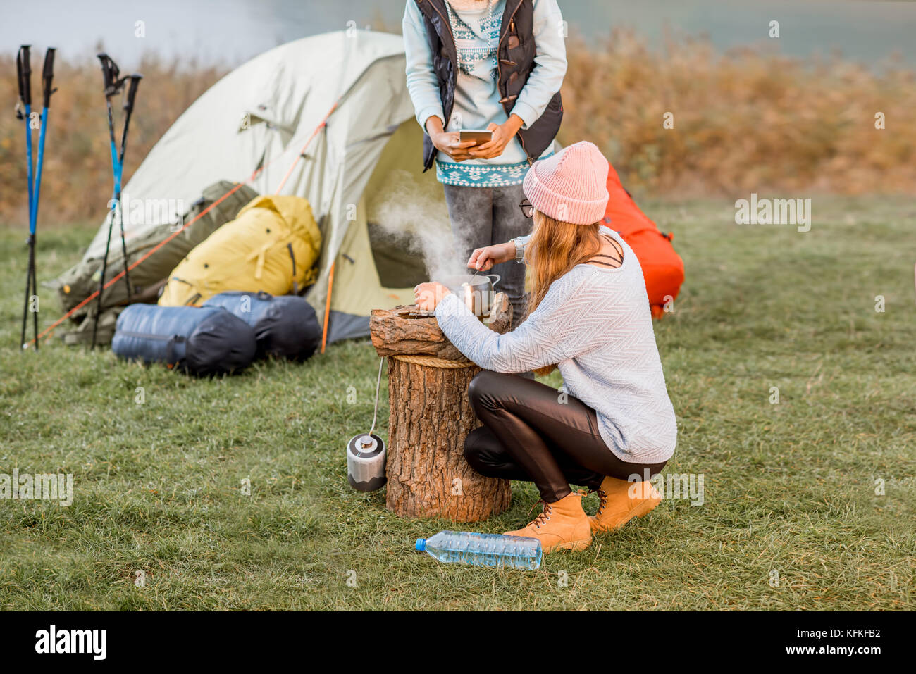 Women cooking food at the camping Stock Photo - Alamy