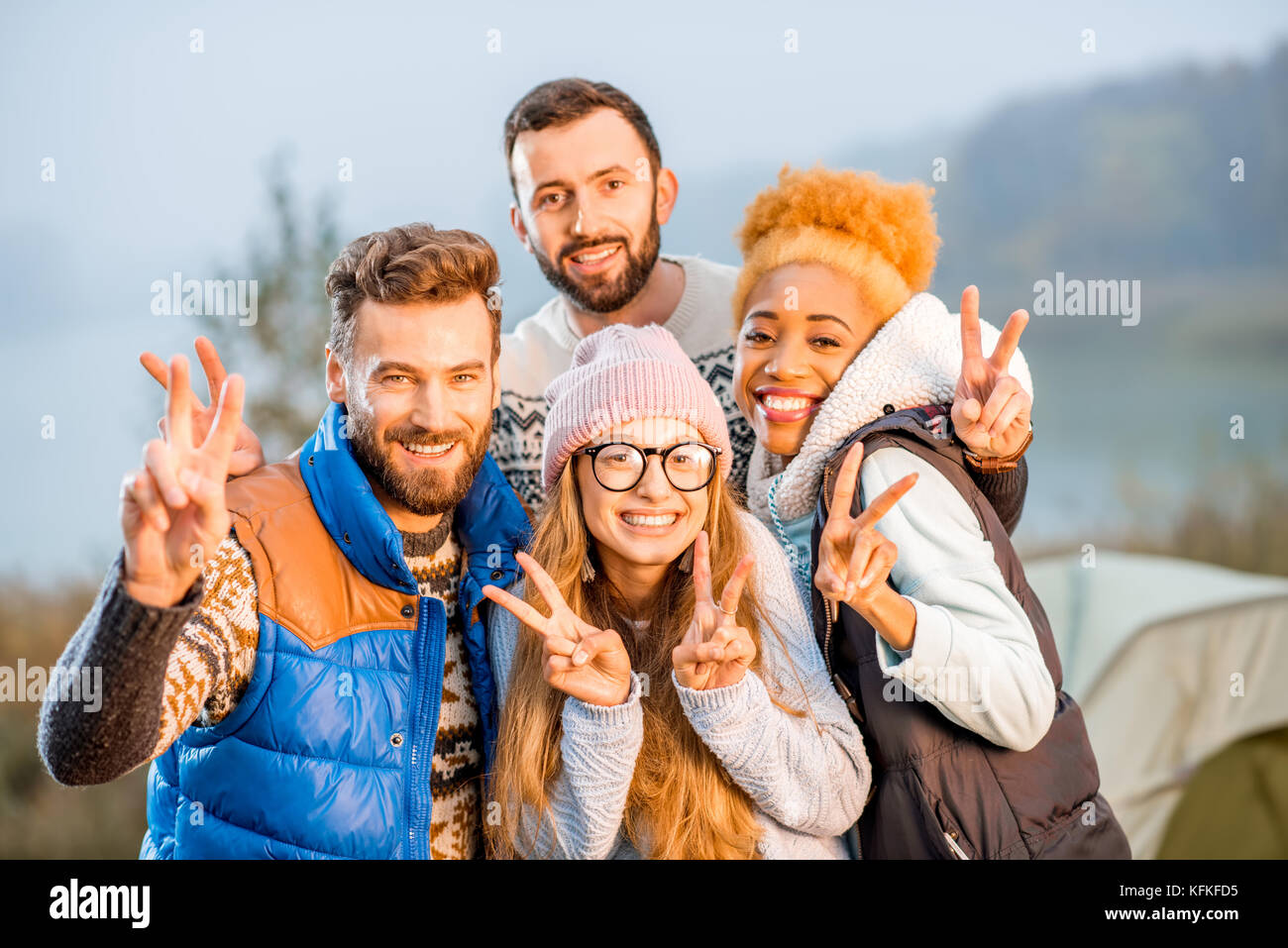 Friends in sweaters during the outdoor recreation Stock Photo - Alamy