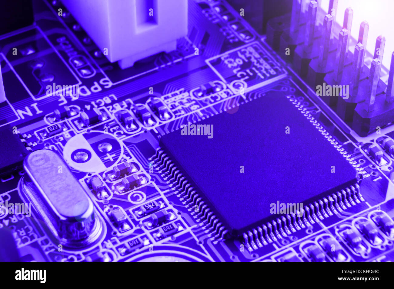 Integrated semiconductor microchip on blue circuit board representative ...