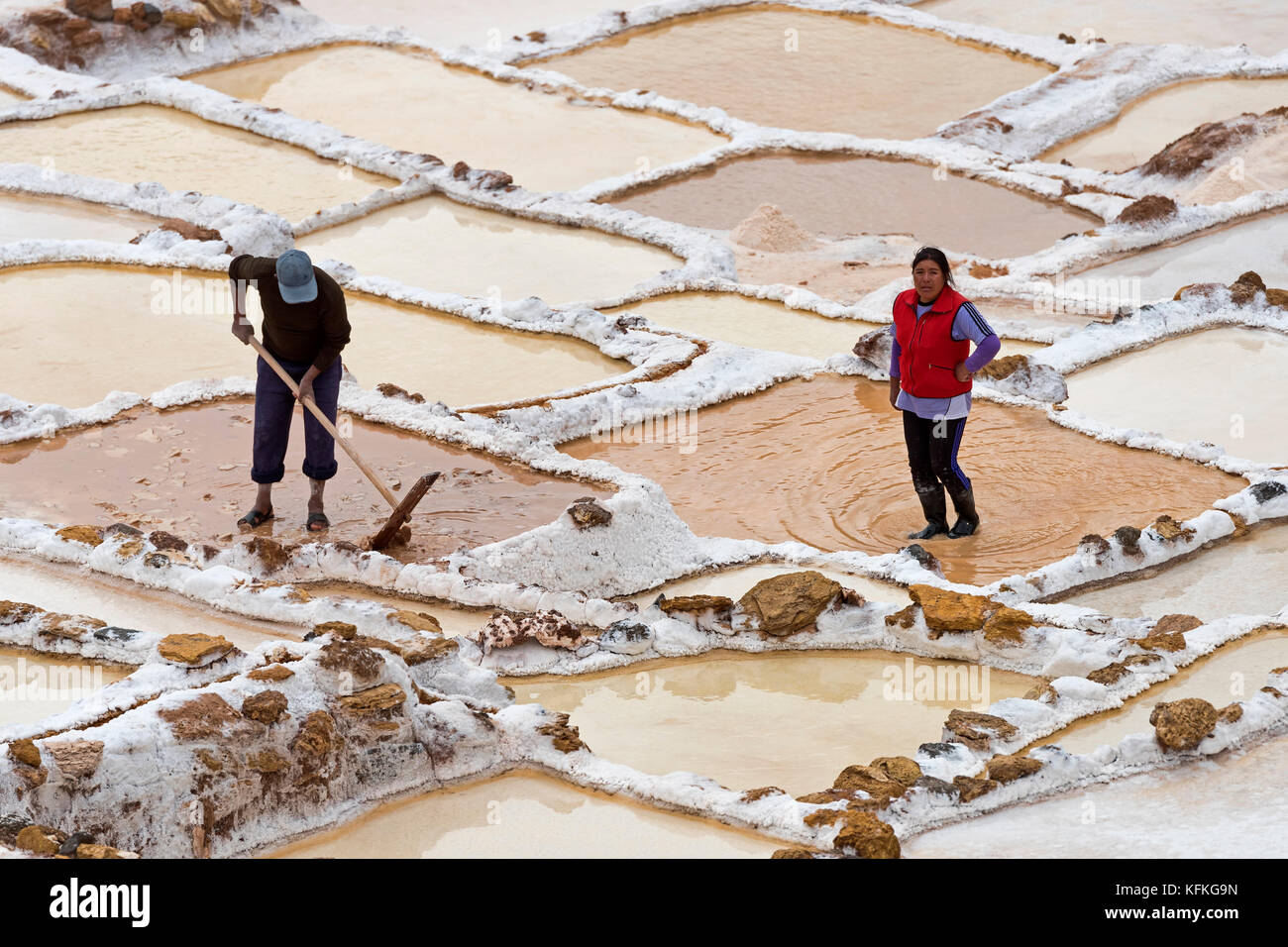 Workers in the salt mines of Maras, Sacred Valley of the Incas ...