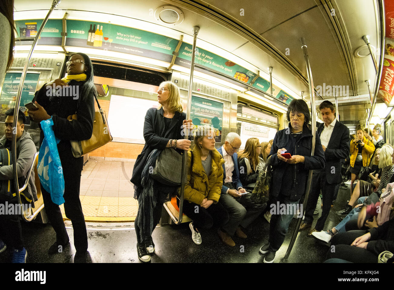 Commuters on a subway train .Columbus Circle, Manhattan, New York City ...