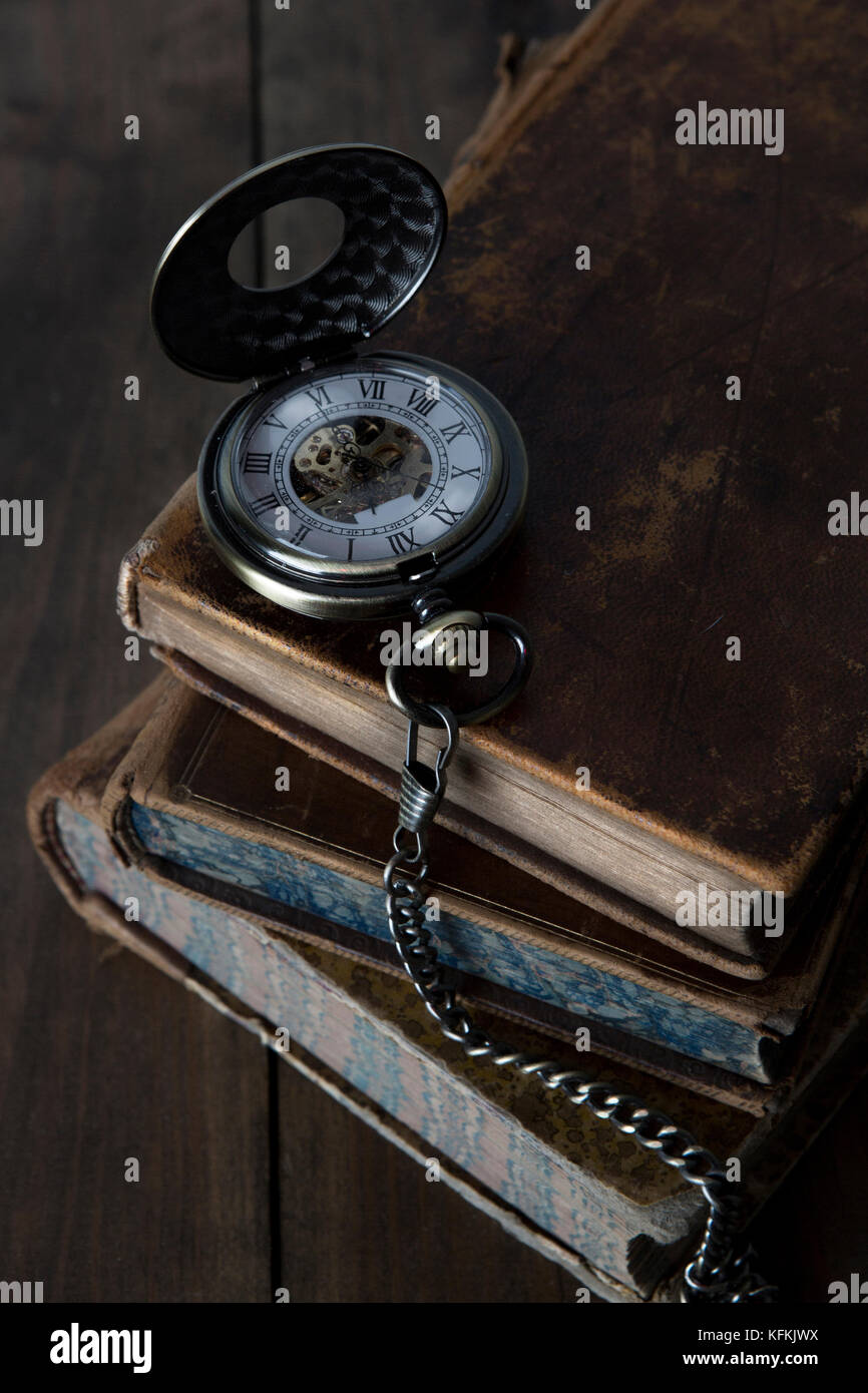 Old Vintage Books With Pocket Watch Stock Photo - Alamy