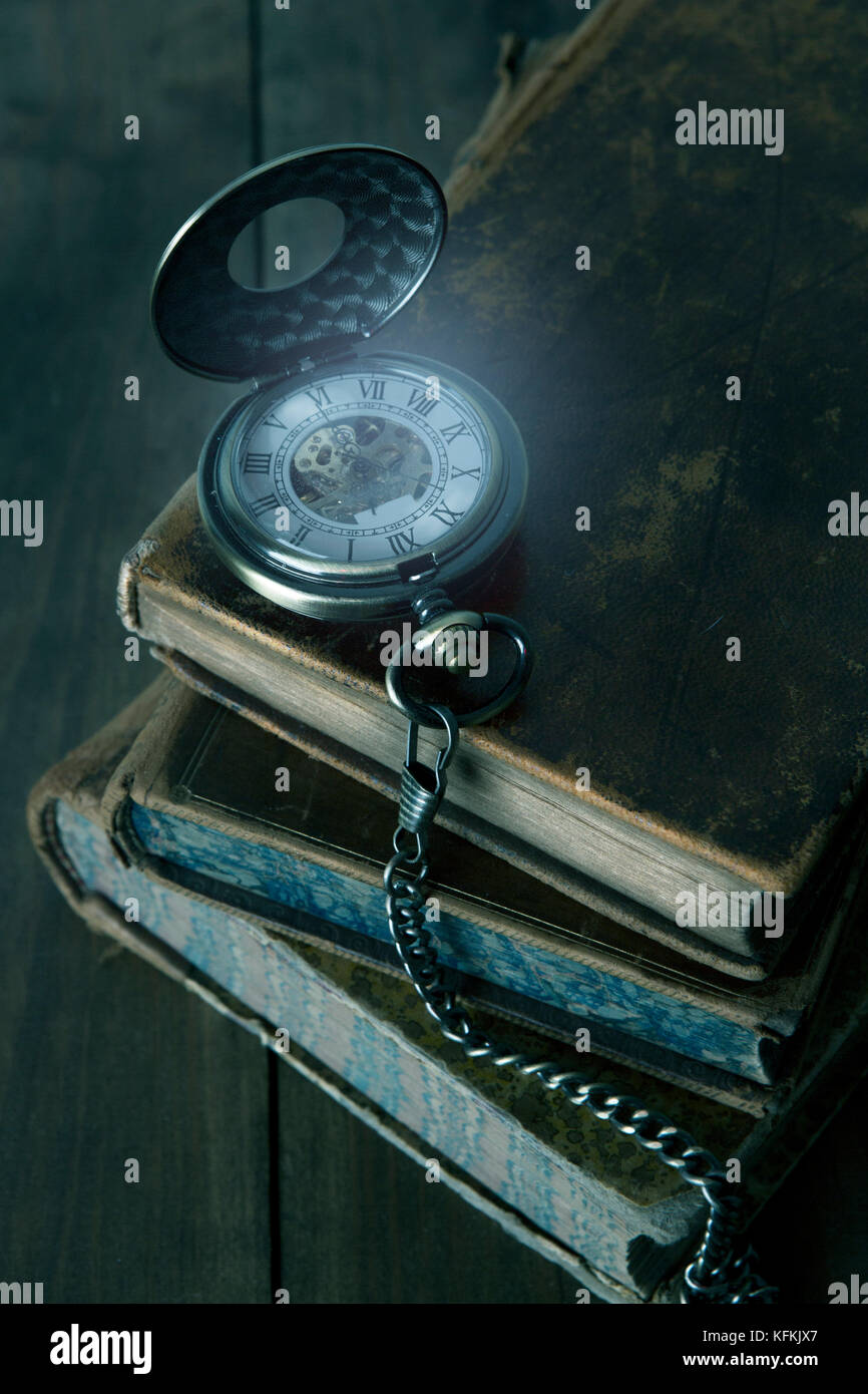Old Vintage Books With Pocket Watch Stock Photo - Alamy