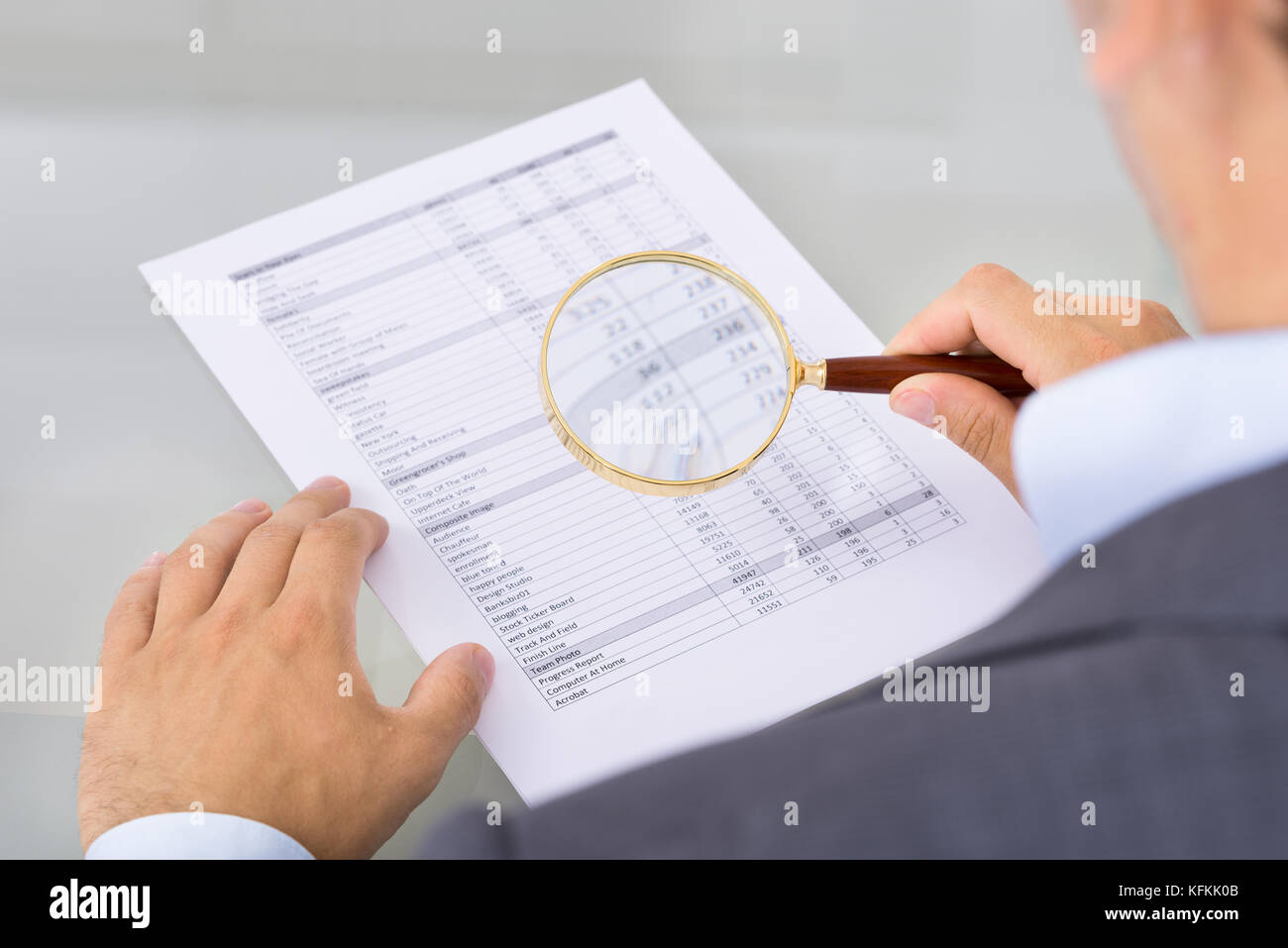 Auditor inspecting document. Over the shoulder view Stock Photo - Alamy
