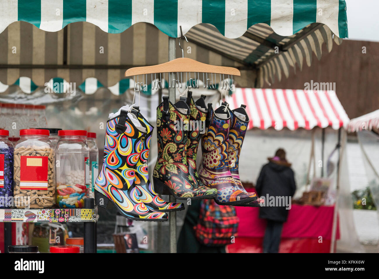 Ullapool market stand selling colored boots Stock Photo - Alamy