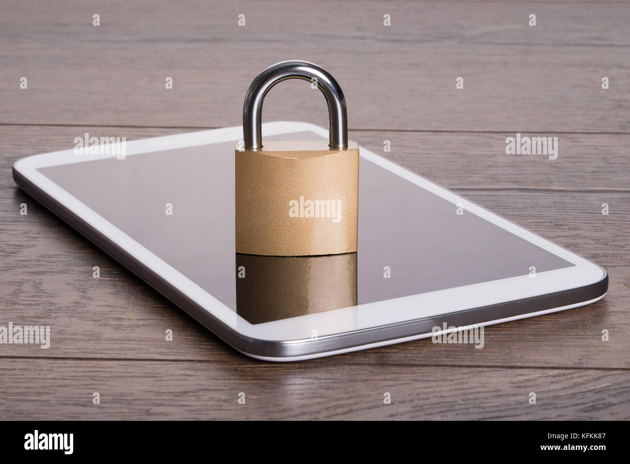Photo of tablet and padlock. Security concept Stock Photo - Alamy