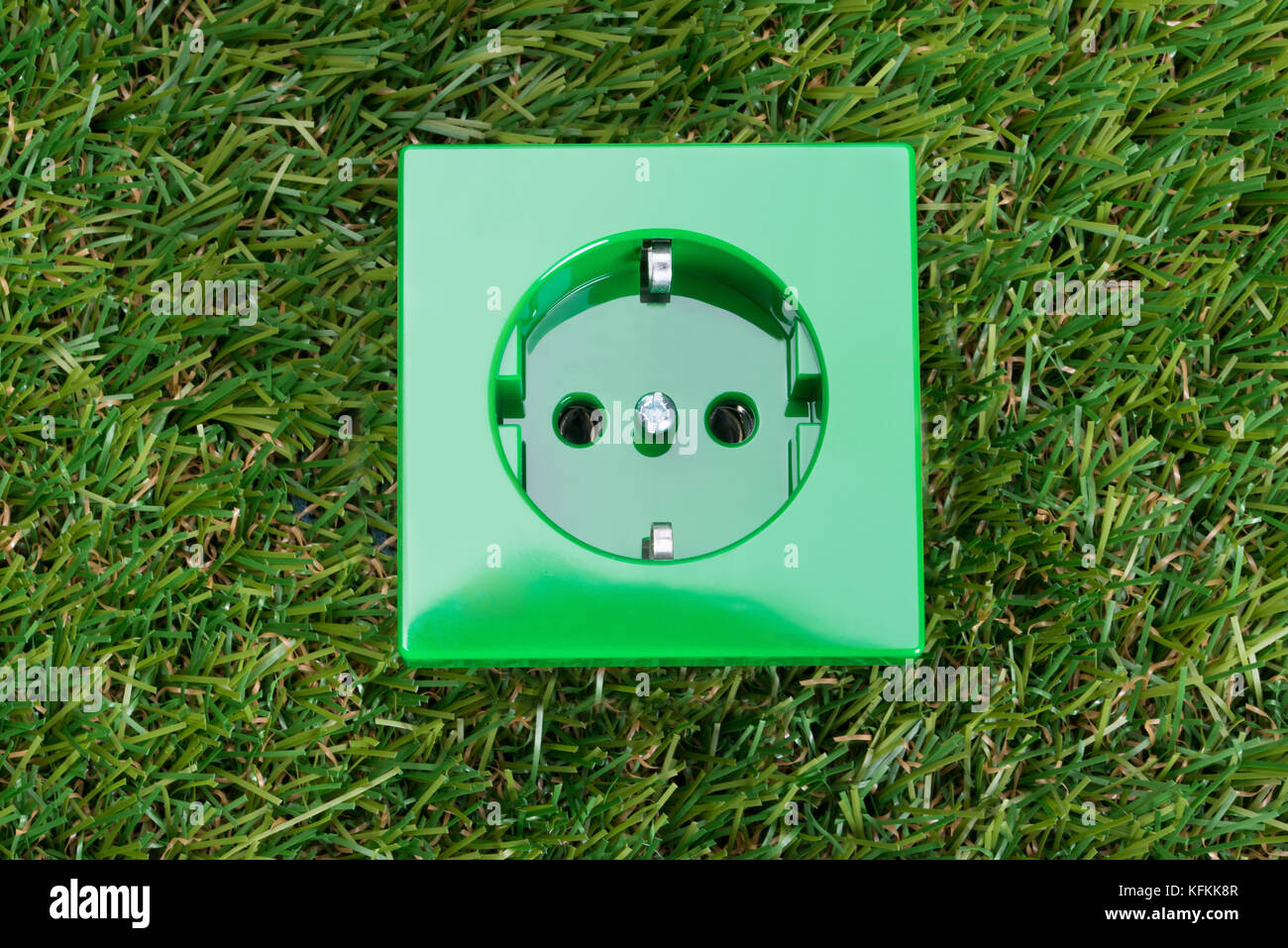 Wall socket on grass. Environmental friendly energy concept Stock Photo ...