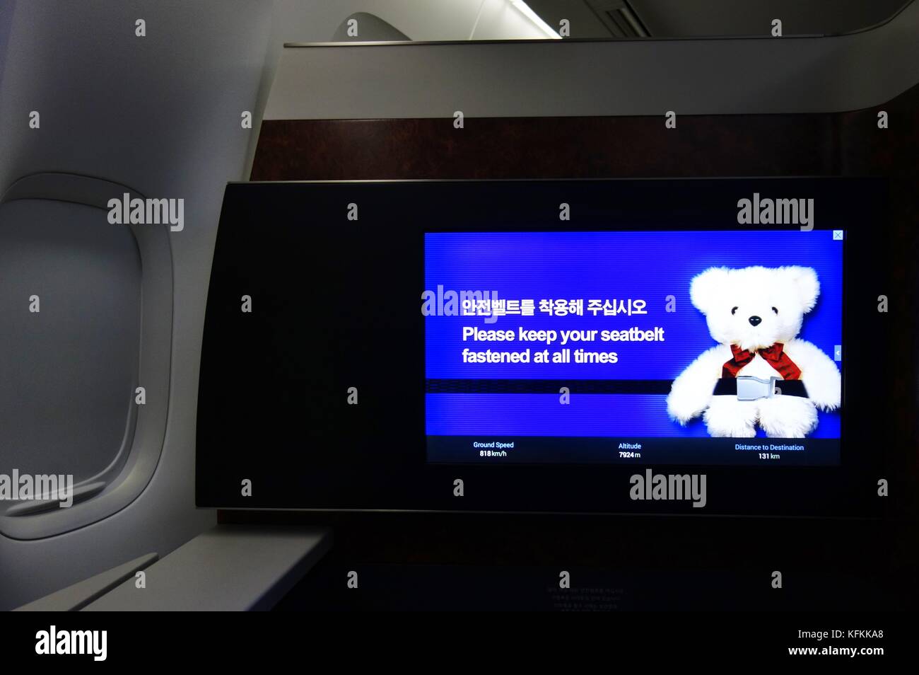 View of azure blue seats and suites inside the First Class cabin of a ...