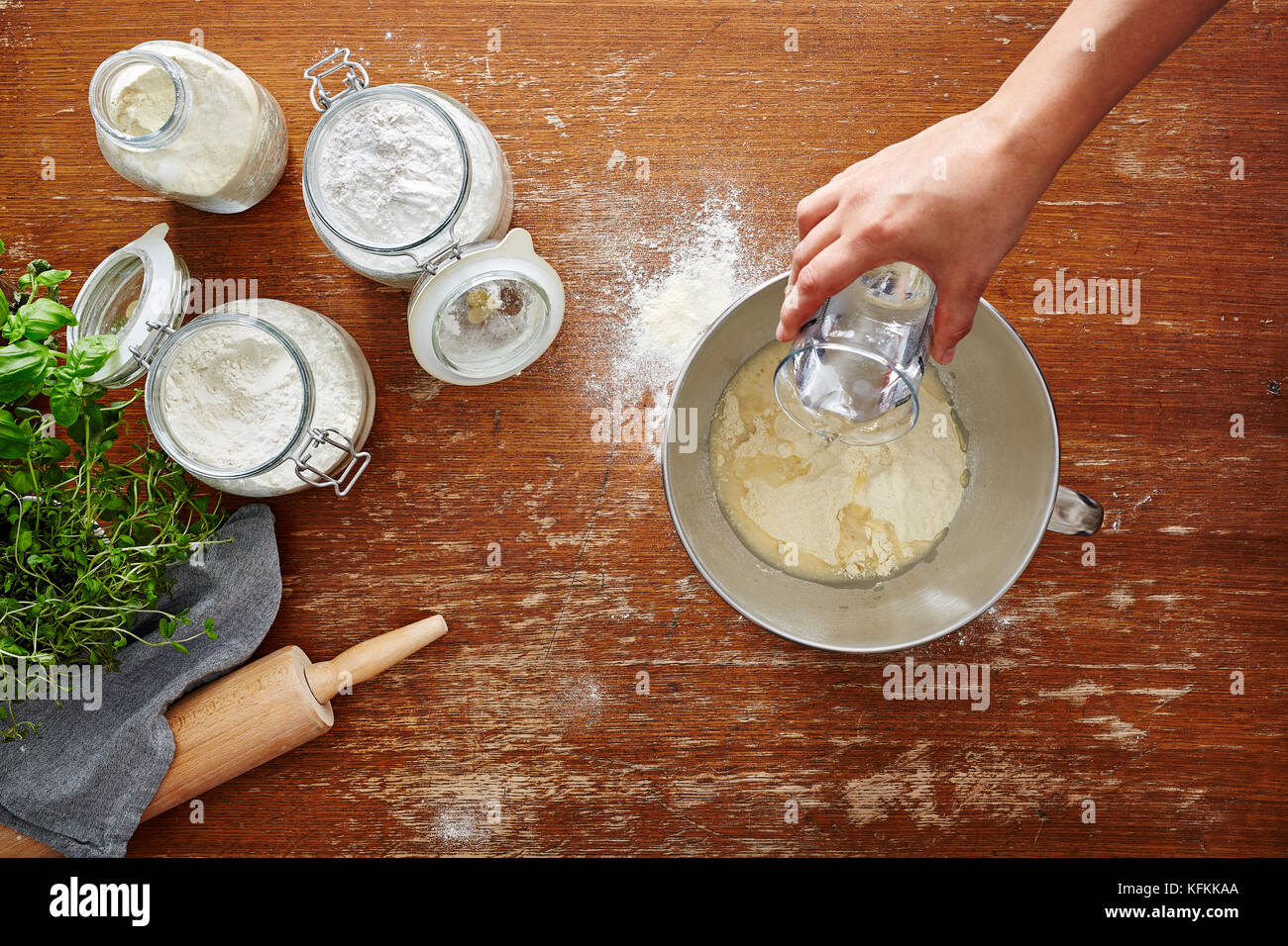 hand adds water to flour homemade pasta making dough flour Stock Photo ...