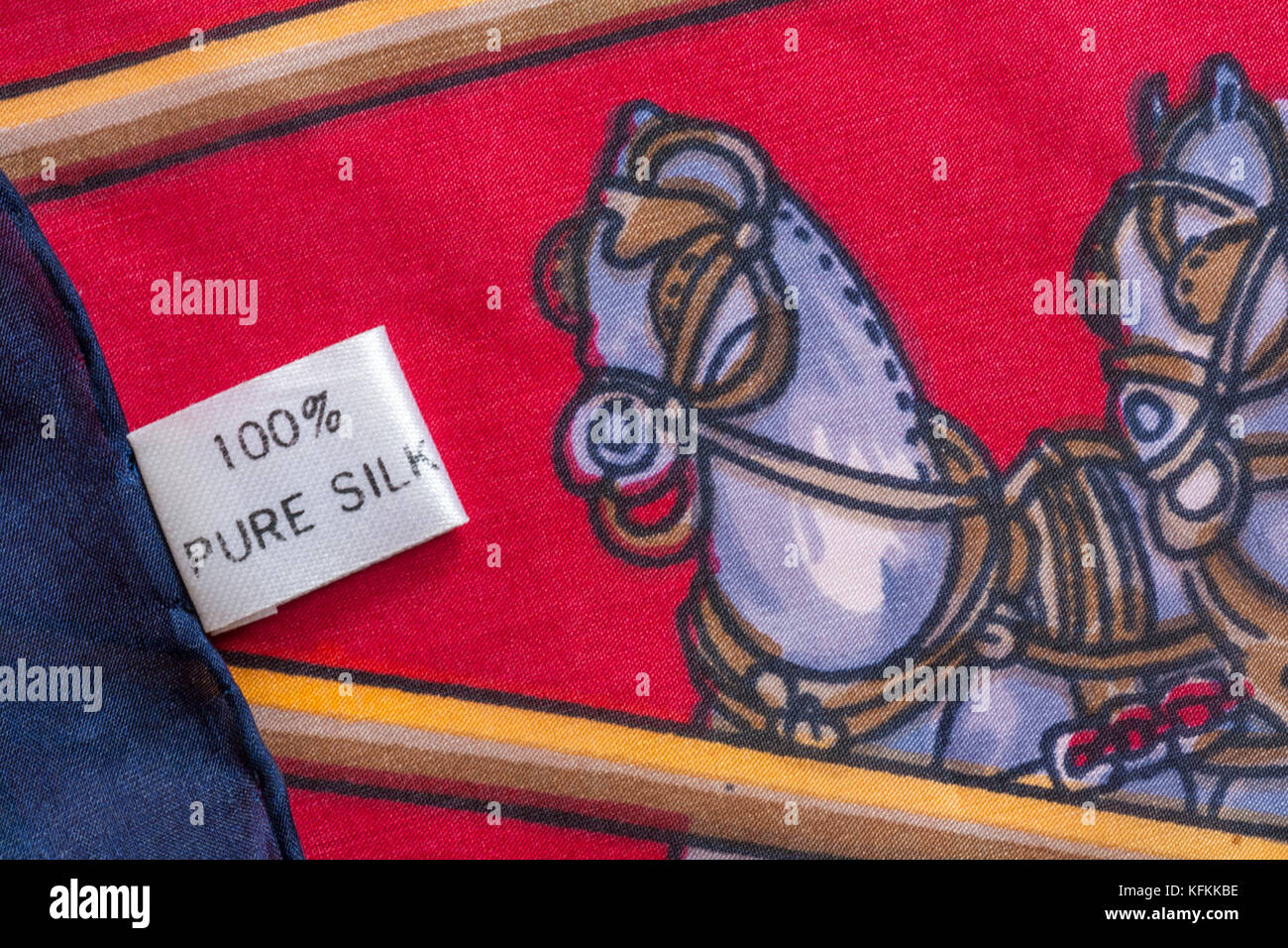 100% pure silk label in woman's scarf Stock Photo - Alamy