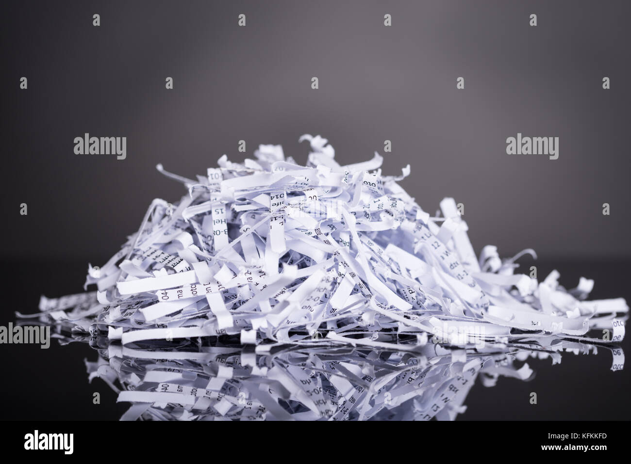 Pile of shredded documents over black background Stock Photo - Alamy