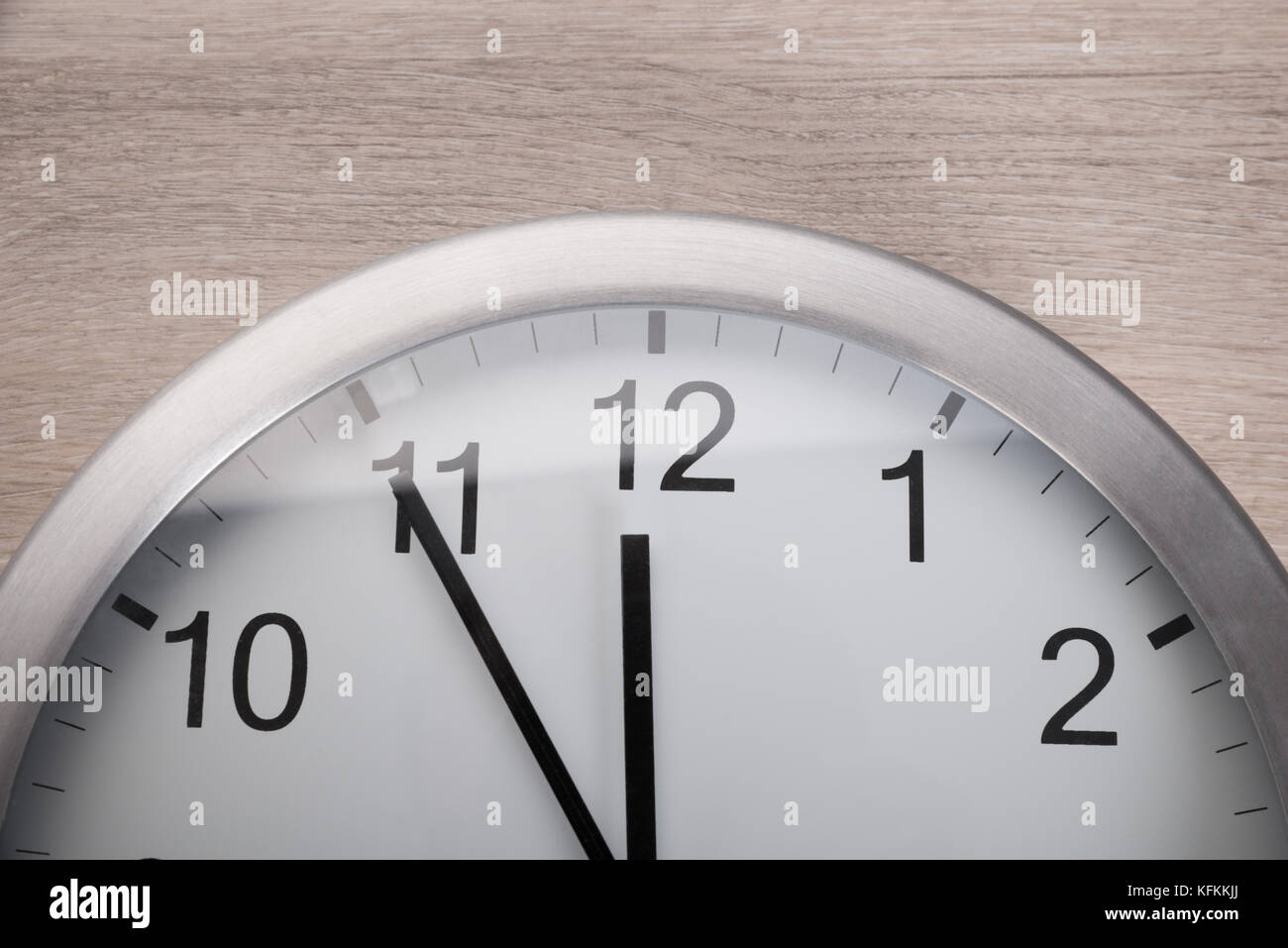 High angle view on clock showing five before noon Stock Photo - Alamy