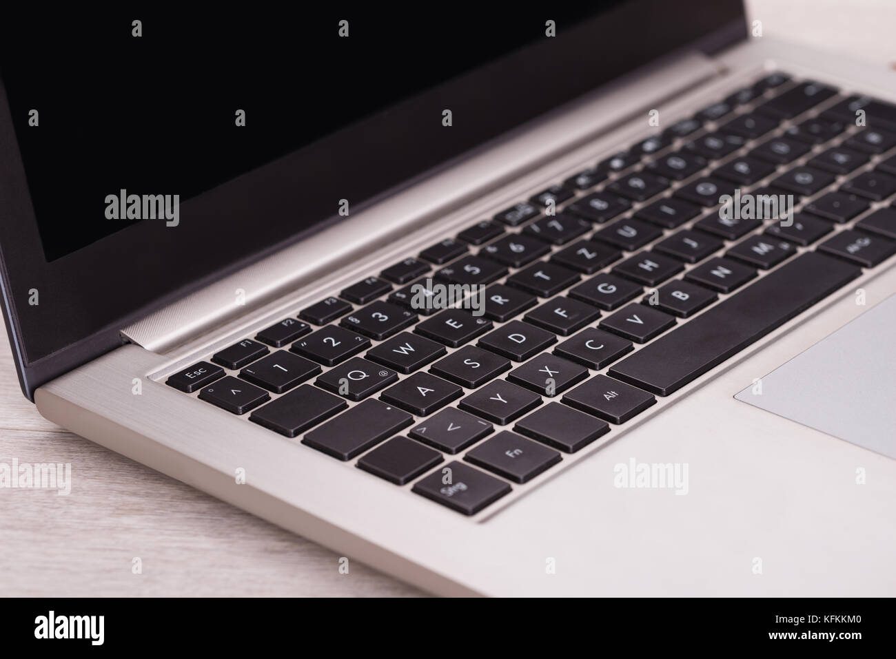 Keyboard of laptop computer on wooden table Stock Photo - Alamy